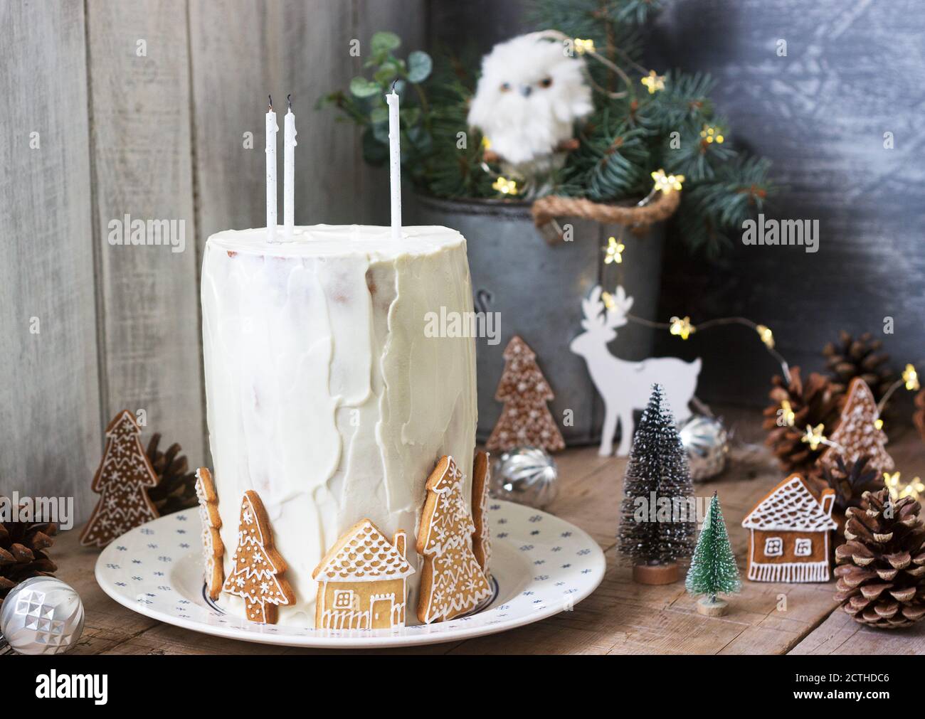 Homemade honey cake with sour cream, decorated with gingerbread. Rustic ...