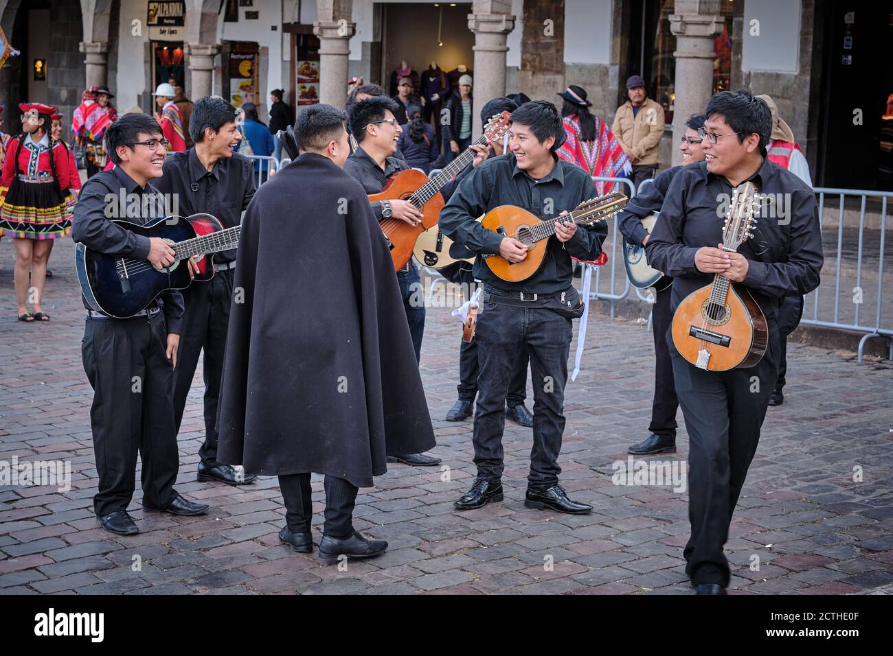An all-male string instrument band dressed in black during the Inti ...
