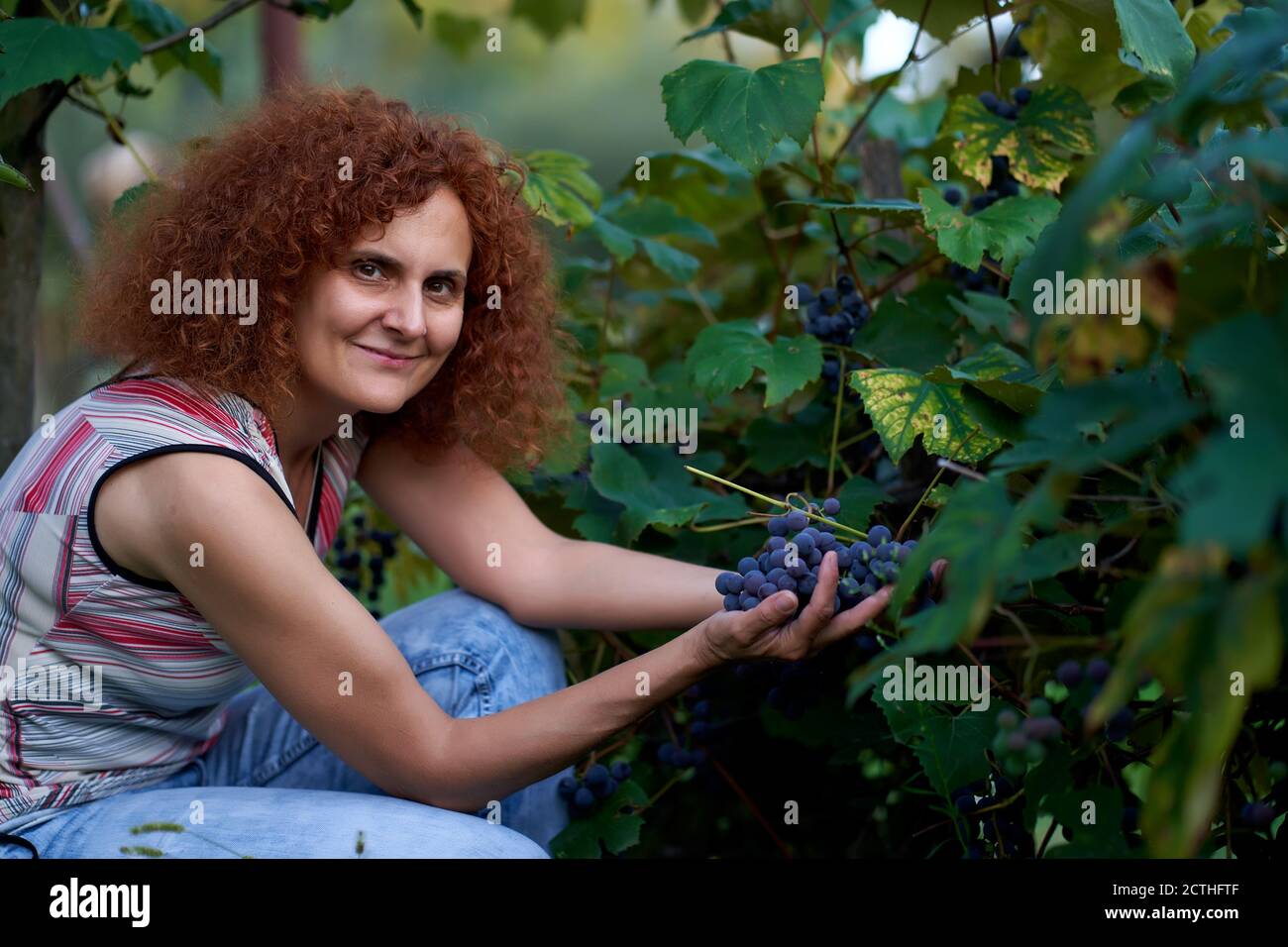 Happy curly haired redhead woman hi-res stock photography and images ...