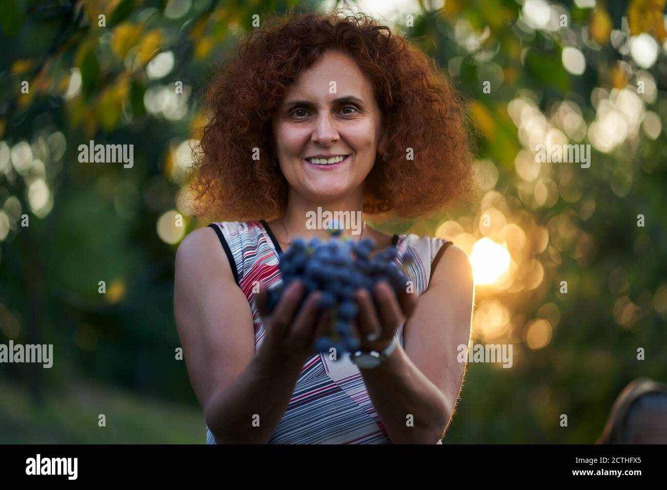 Happy curly haired redhead woman hi-res stock photography and images ...