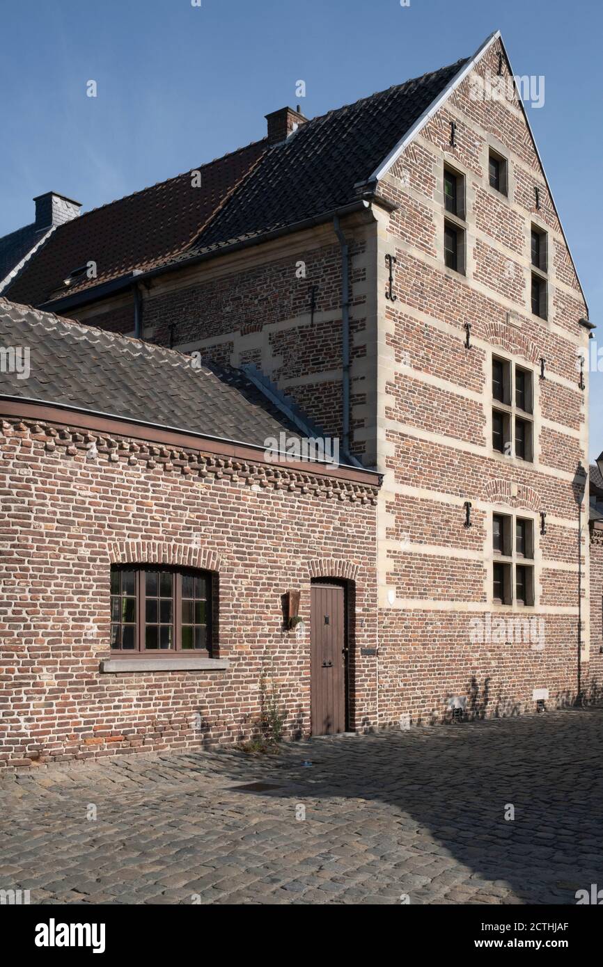 Facades of restored houses at the Begijnhof or Beguinage in the streets ...
