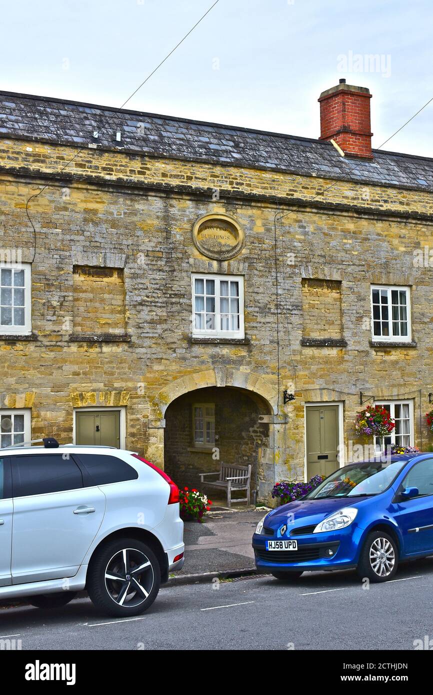 A detail of the archway and wall plaque of Tontine Buildings, a terrace ...