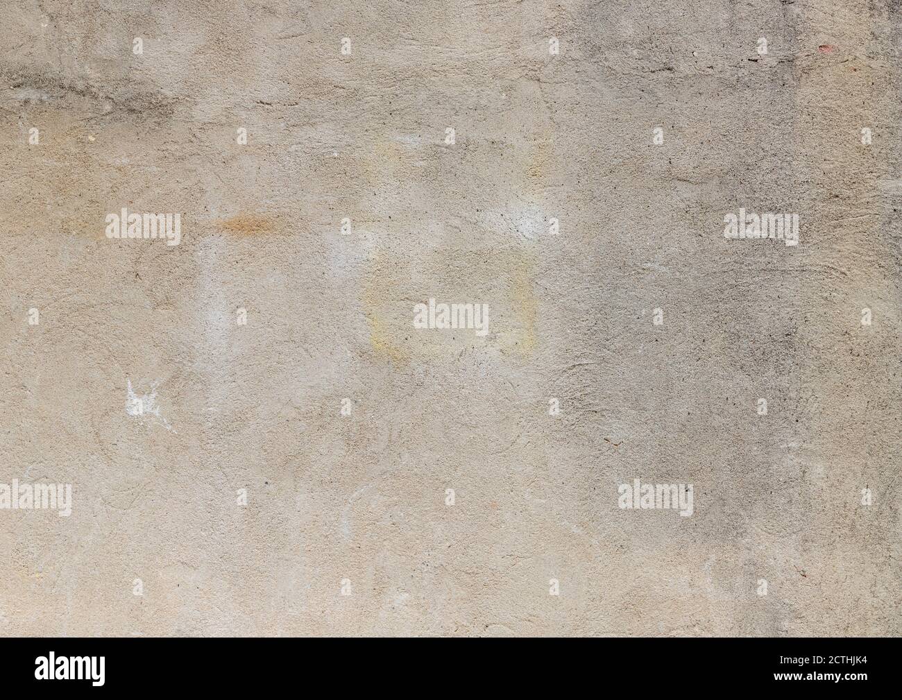 Finely textured concrete wall in shades of tan and grey, creative urban ...