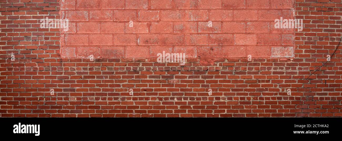 Panorama of red brick with red painted concrete block insert, vignette ...