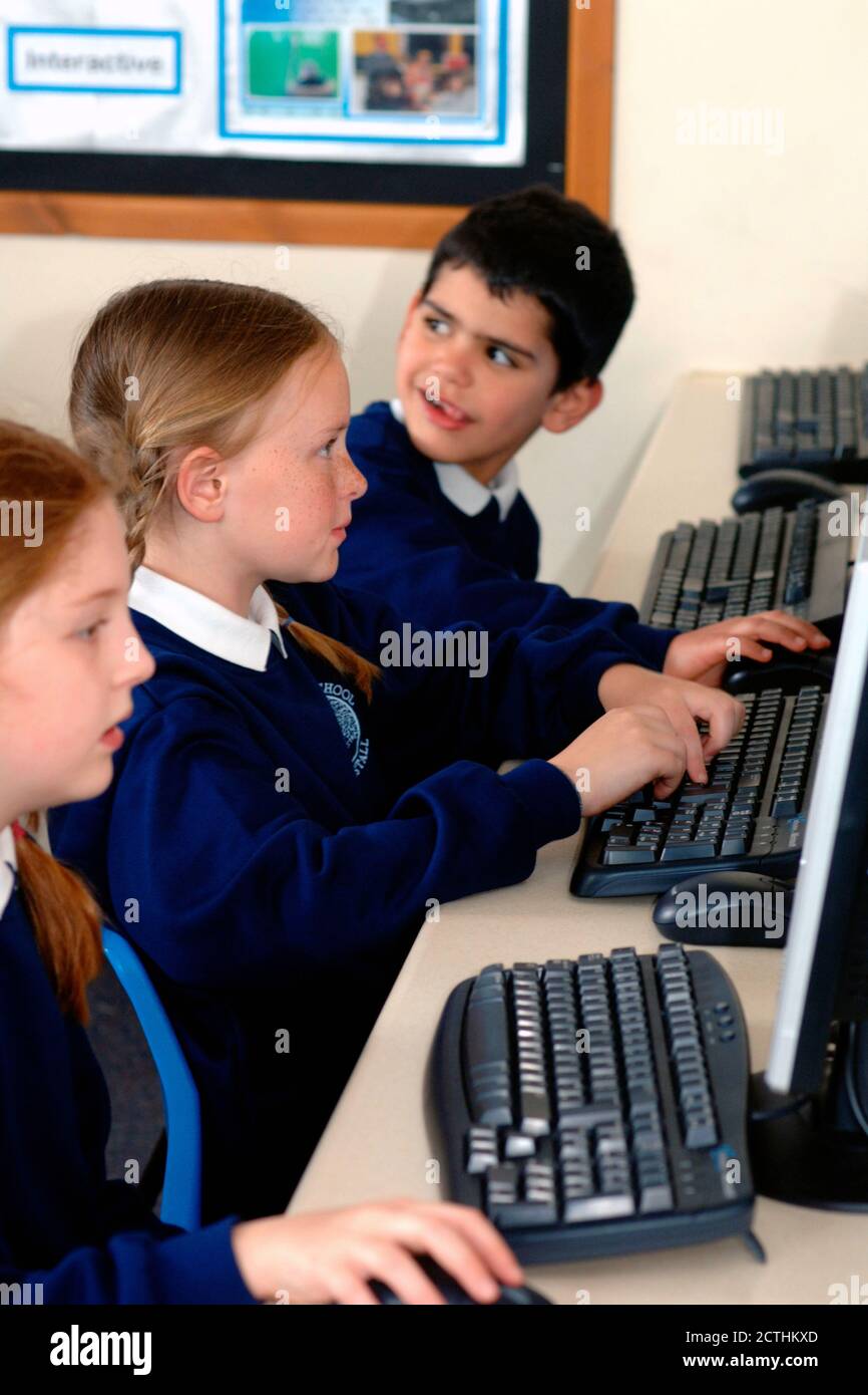 Primary schoolchildren using computers; Yorkshire UK Stock Photo - Alamy
