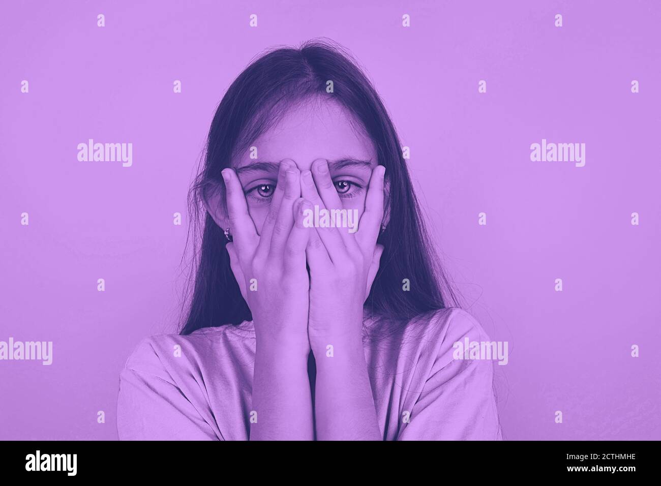 Hiding face. Close up portrait of caucasian girl isolated on studio ...