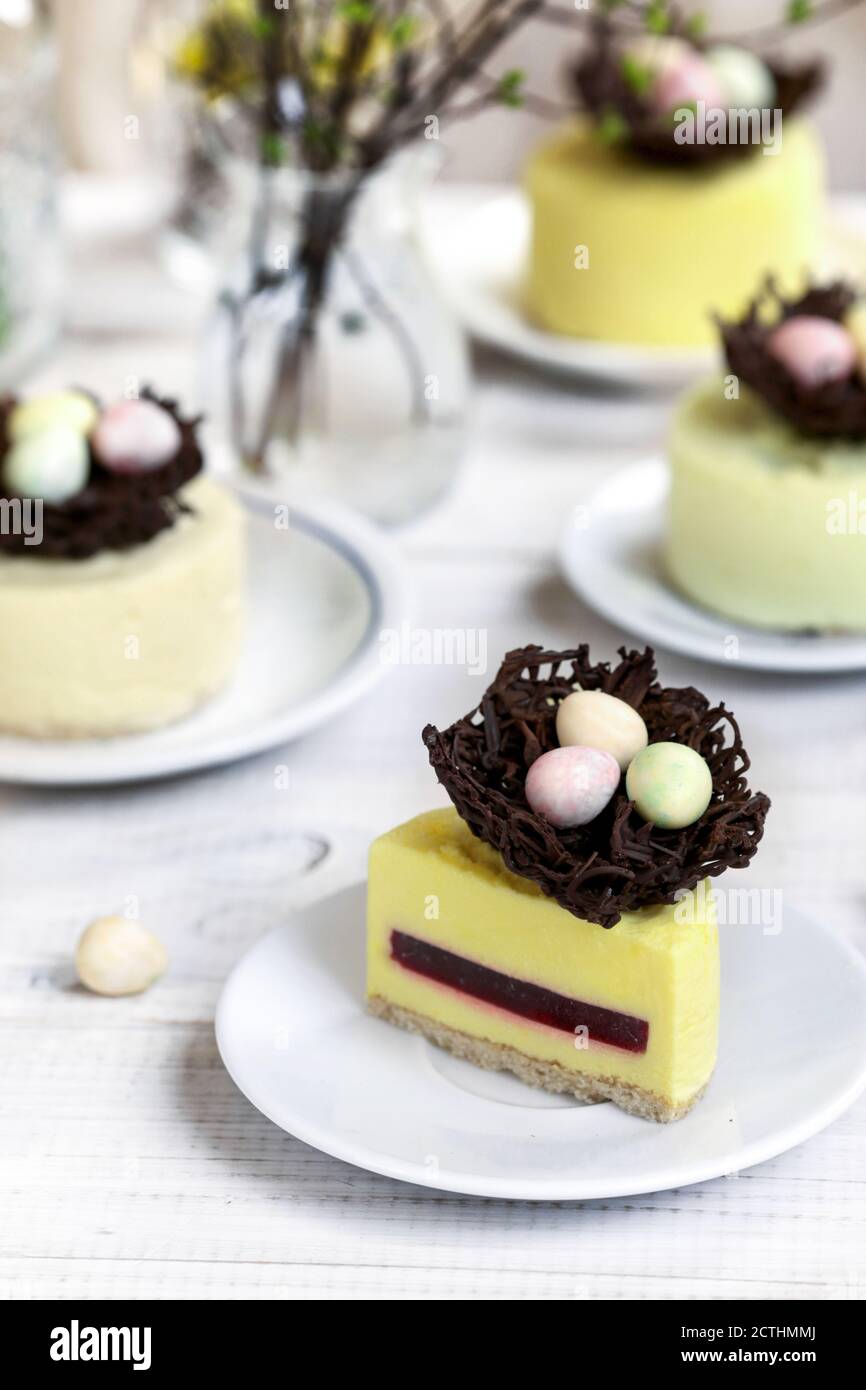 Easter pastel mousse desserts and spring flowers Stock Photo - Alamy