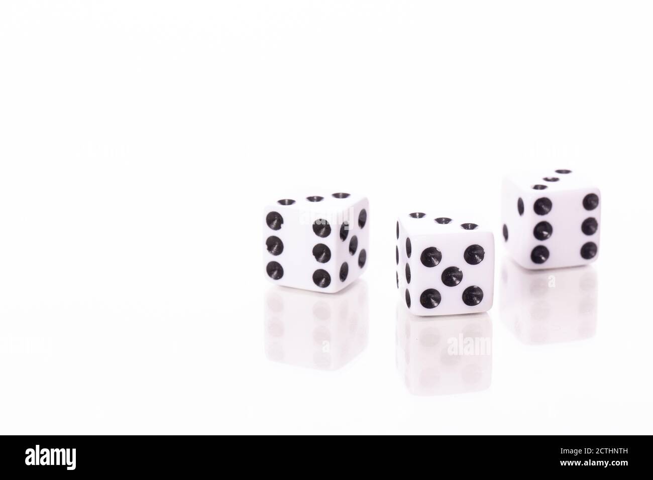 three white dice black pips showing three copy space Stock Photo - Alamy