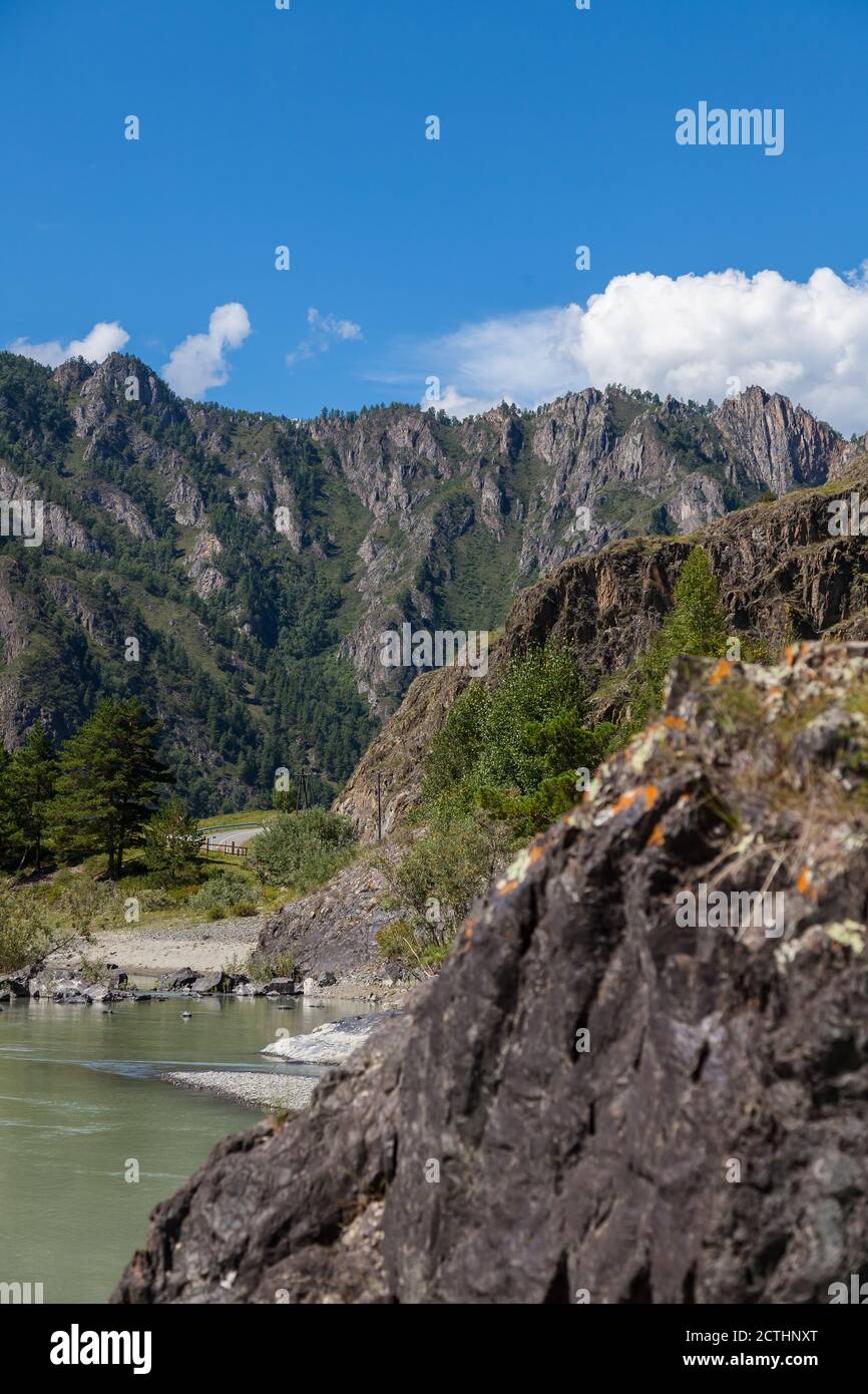 A close-up of a mountain range with brown and gray rocky cliffs with ...