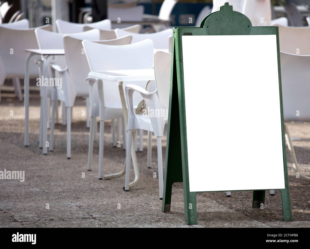 outdoor street restaurant mockup poster, white tables in the background ...
