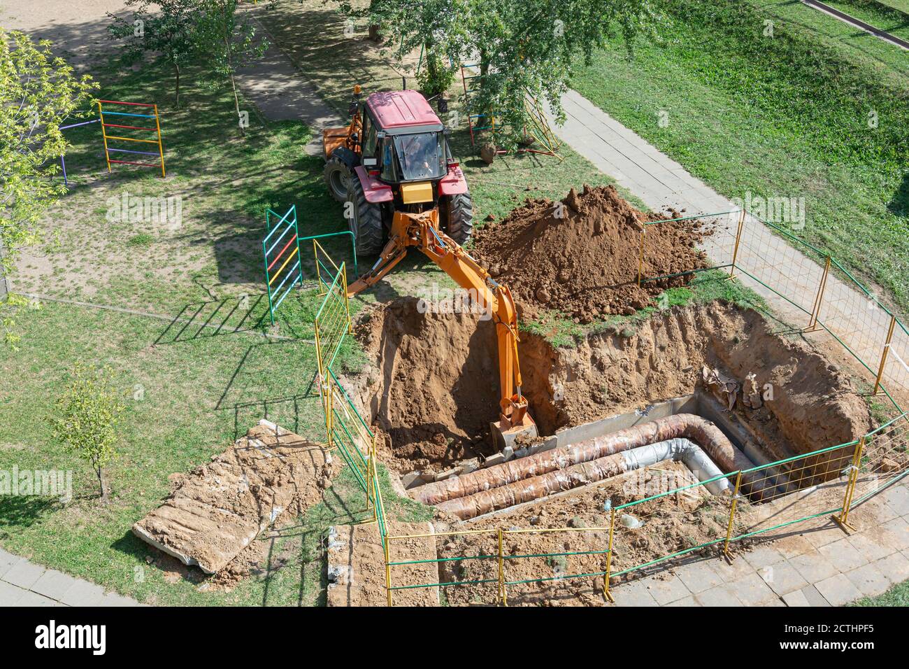 Minsk, Belarus - September 12: Tractor digs a pit to repair a ruptured ...