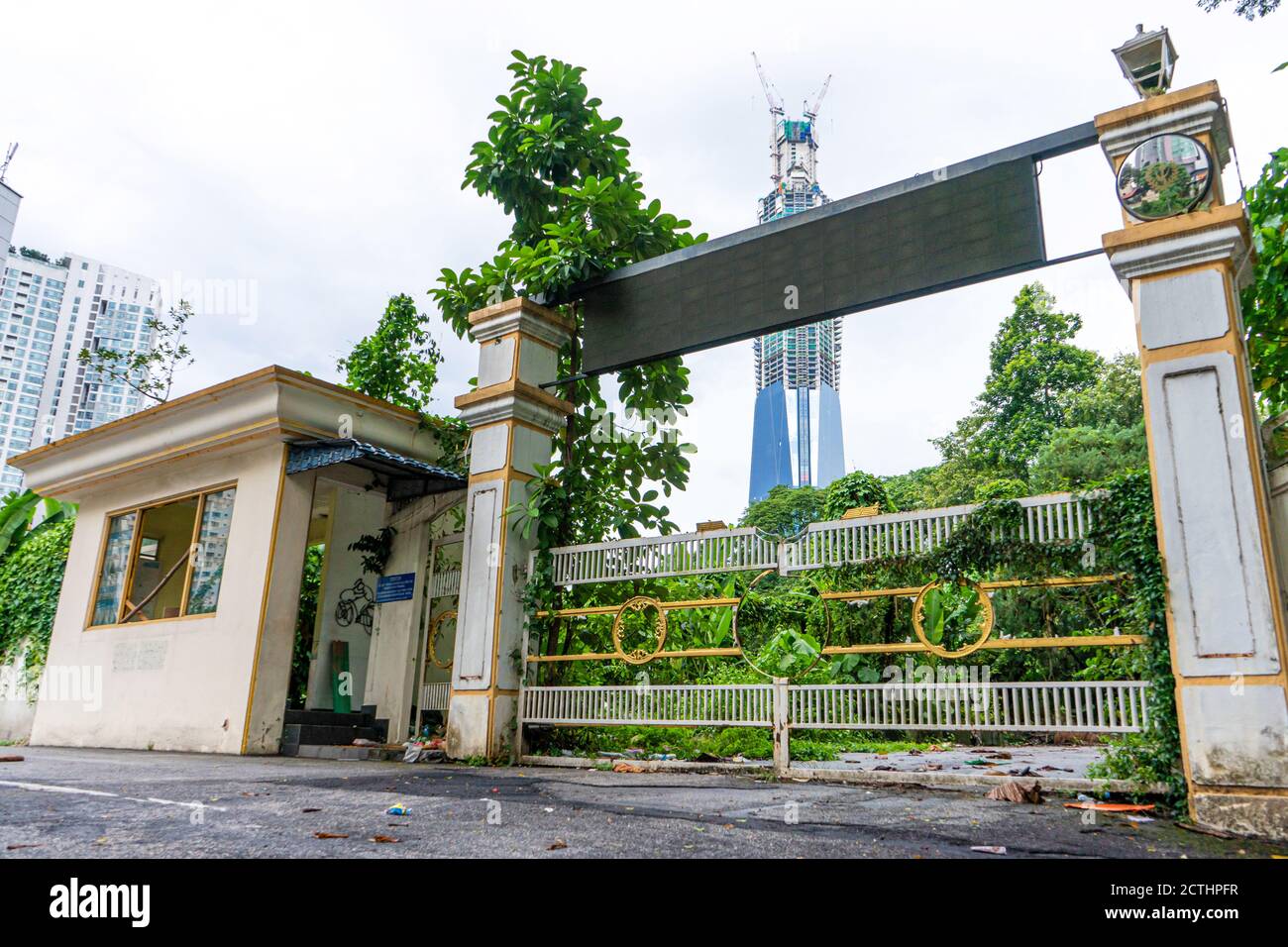 Checkpoint with metal gate to the green park Stock Photo - Alamy