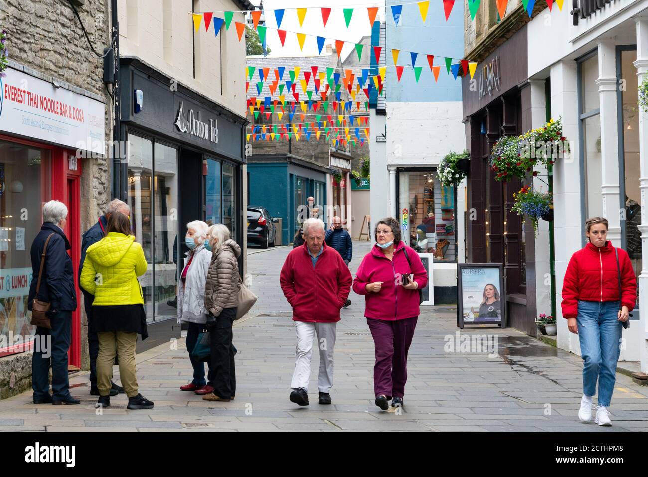 View of shops and people on Commercial Street in old town of Lerwick ...