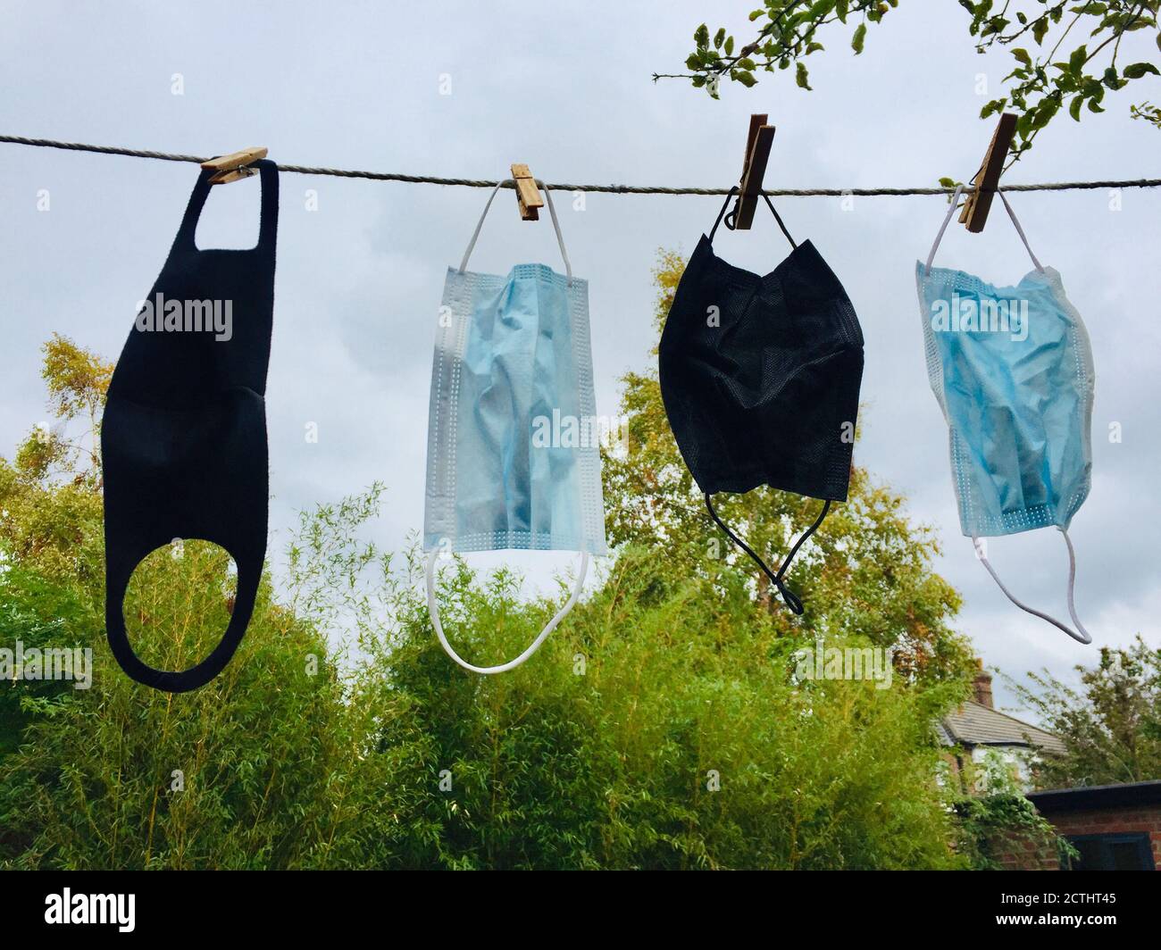 face masks on washing clothes line reusable and washed masks for ...