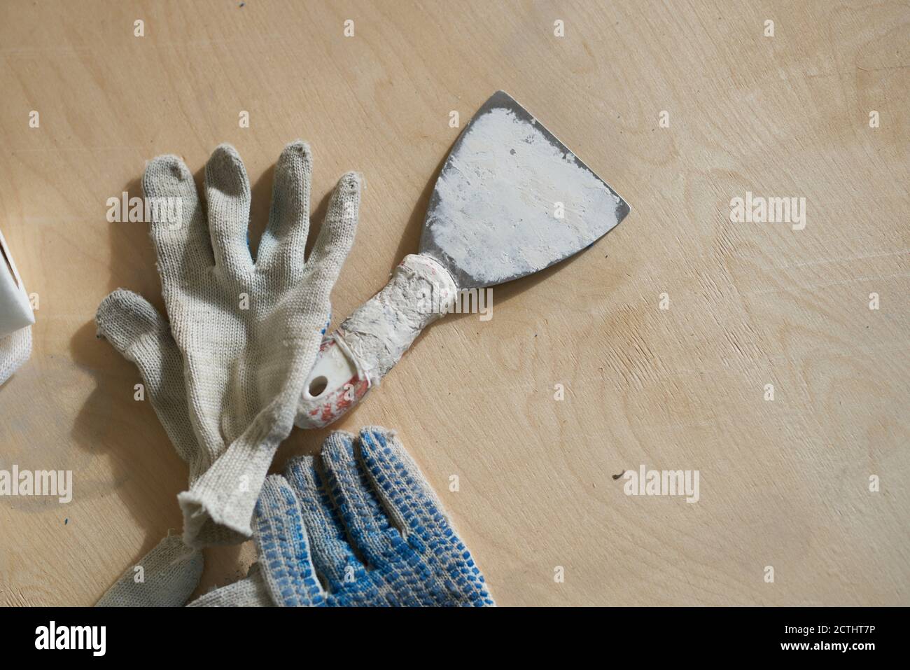 construction gloves putty knife repair work tools Stock Photo - Alamy