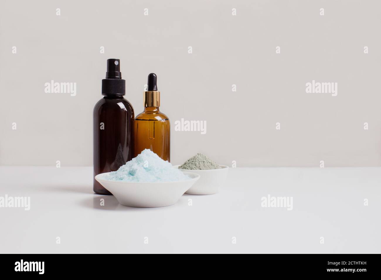 Sea salt, serum in brown dropper glass and spray bottle, clay for hair ...