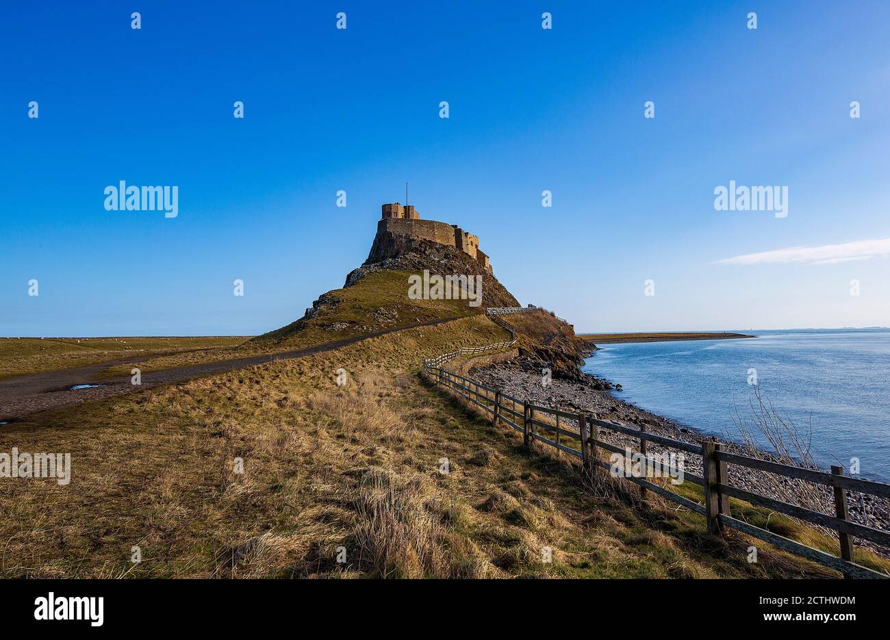 Holy island lindisfarne castle causeway hi-res stock photography and ...
