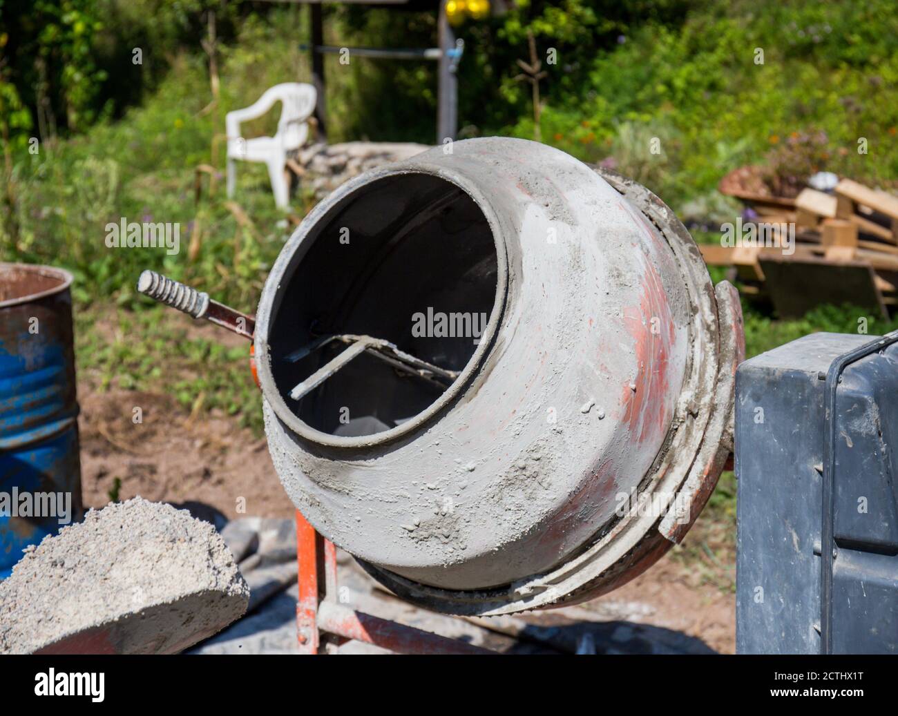 concrete mixer, construction work in progress. Mixer positioned and ...