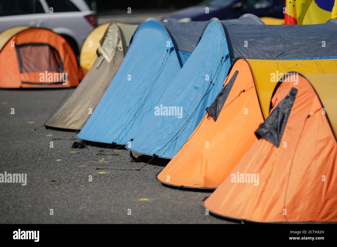 Tents on the pavement during a protest Stock Photo - Alamy