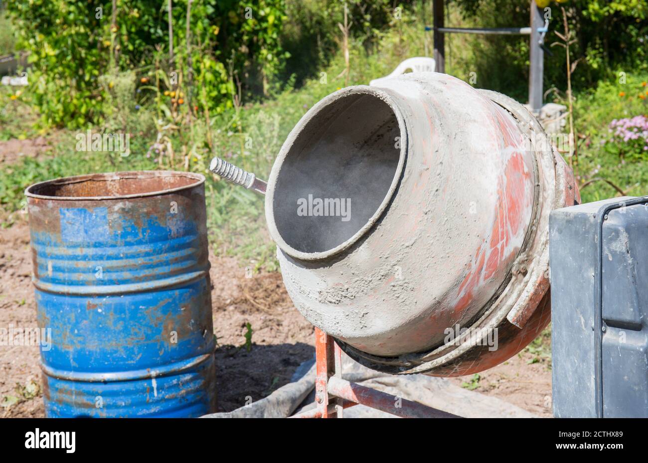 concrete mixer, construction work in progress. Mixer positioned and ...