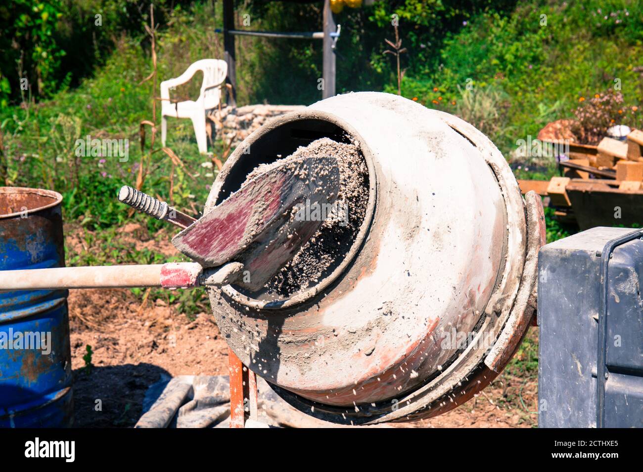 concrete mixer, construction work in progress. Mixer positioned and ...