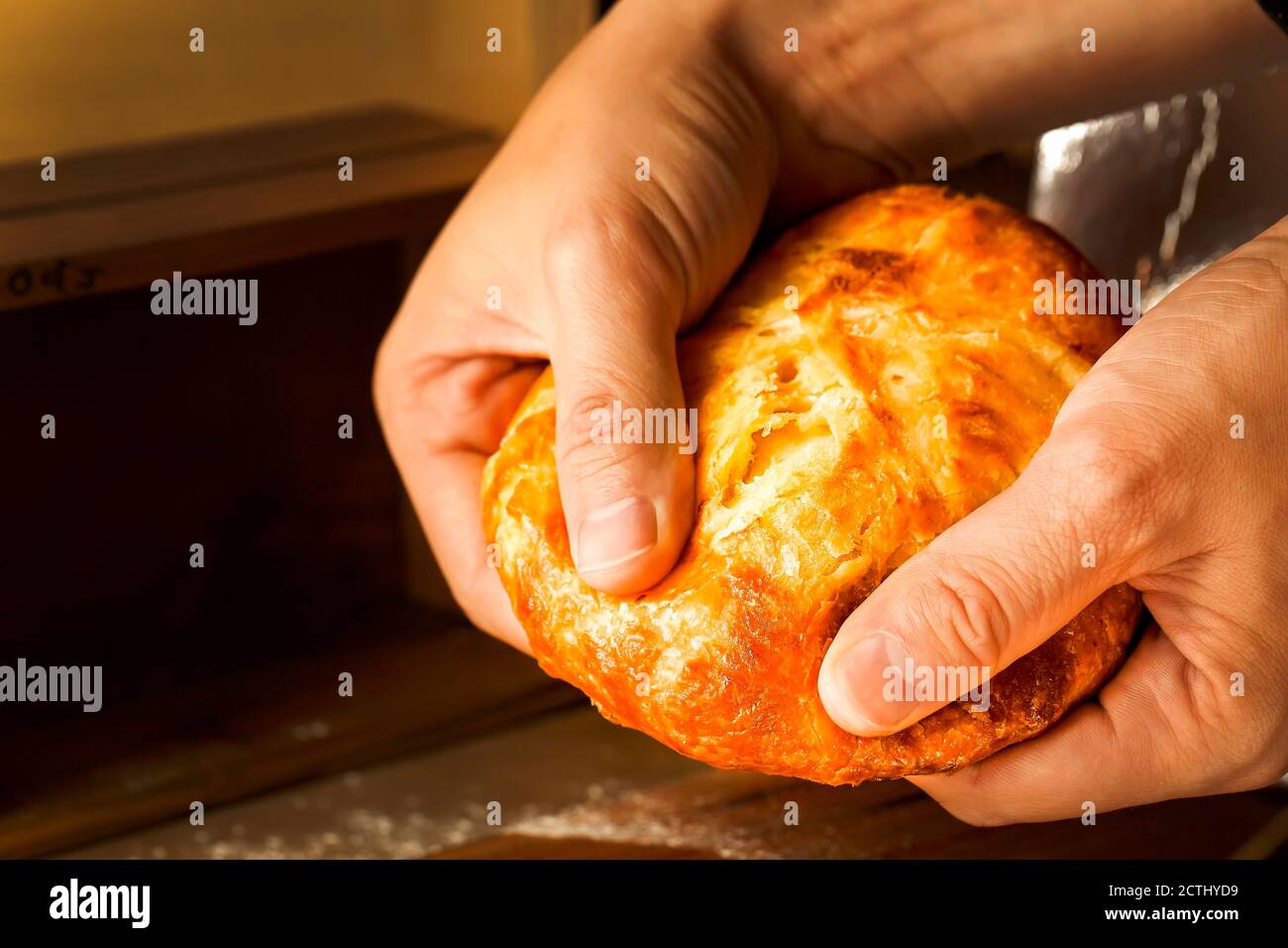 An oriental flatbread stuffed with meat in the hands of a man. Pita ...