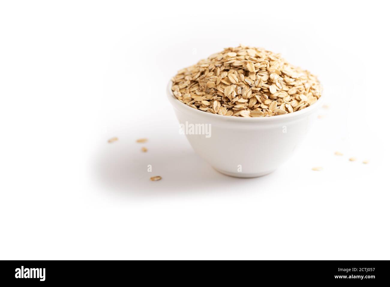 Side view of an oat flakes bowl isolated on a white background Stock ...