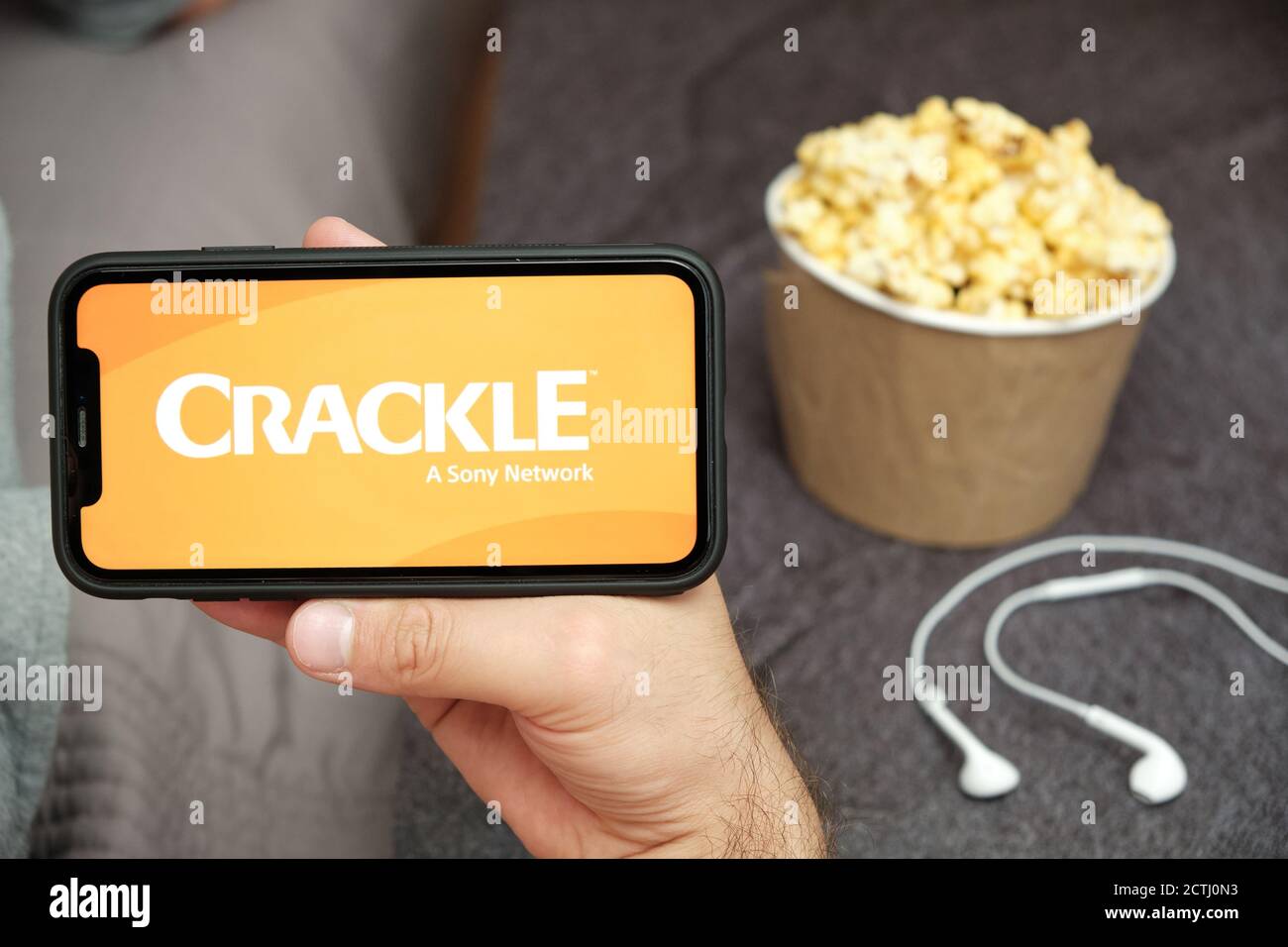 Crackle logo on the mobile phone screen with popcorn box and Apple ...