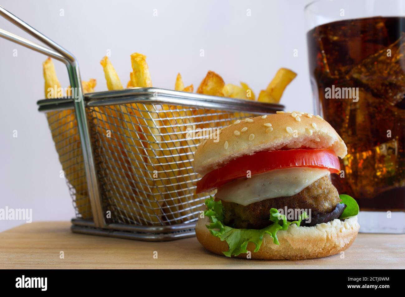 Cheeseburger with Fries and Cold Cola on Wood Board ,on White ...