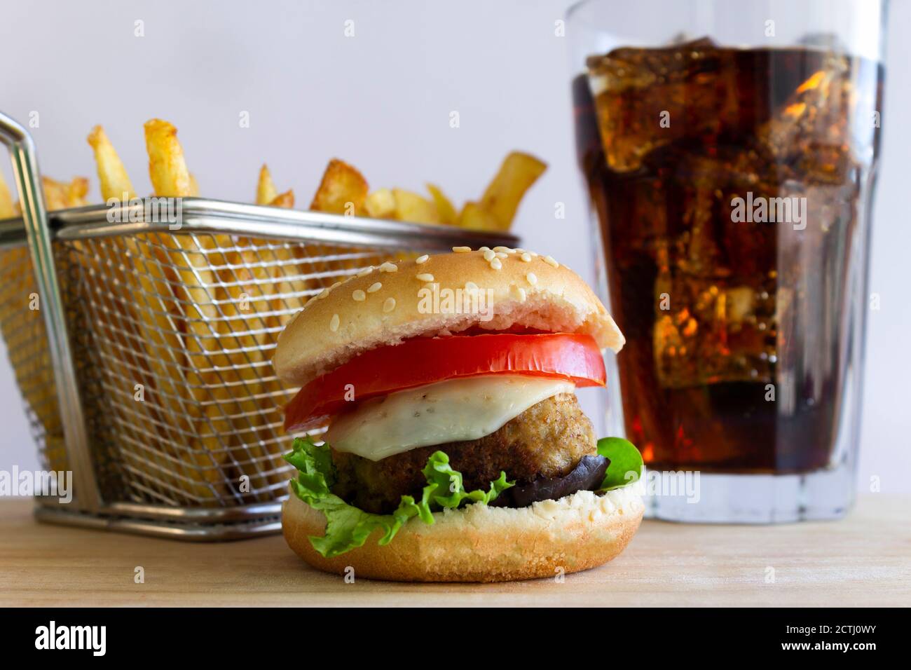 Cheeseburger with Fries and Cold Cola on Wood Board , On White ...