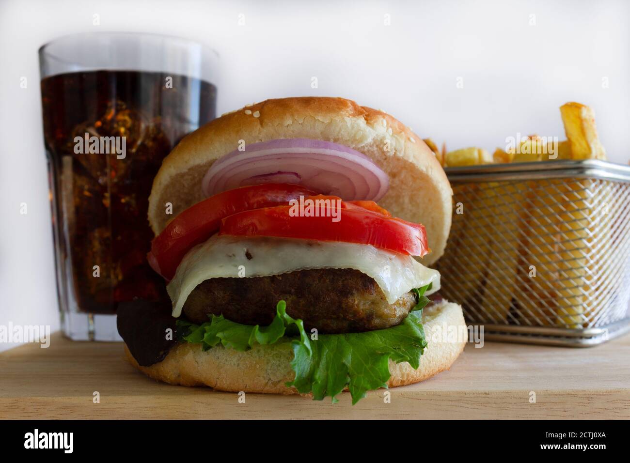 Cheeseburger with Fries and Cold Cola on Wood Board , on White ...