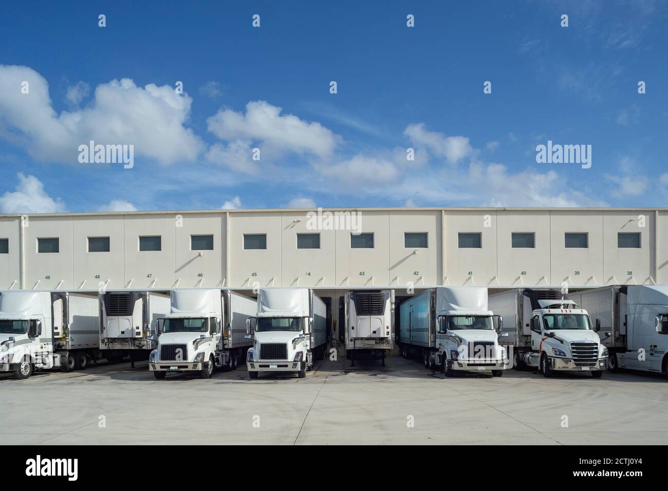 Semi trucks parked in front of warehouse loading dock, Doral, Florida ...