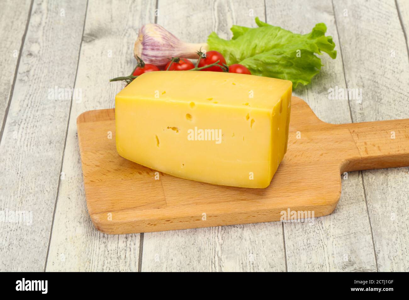 Swiss Hard yellow tasty cheese brick Stock Photo - Alamy
