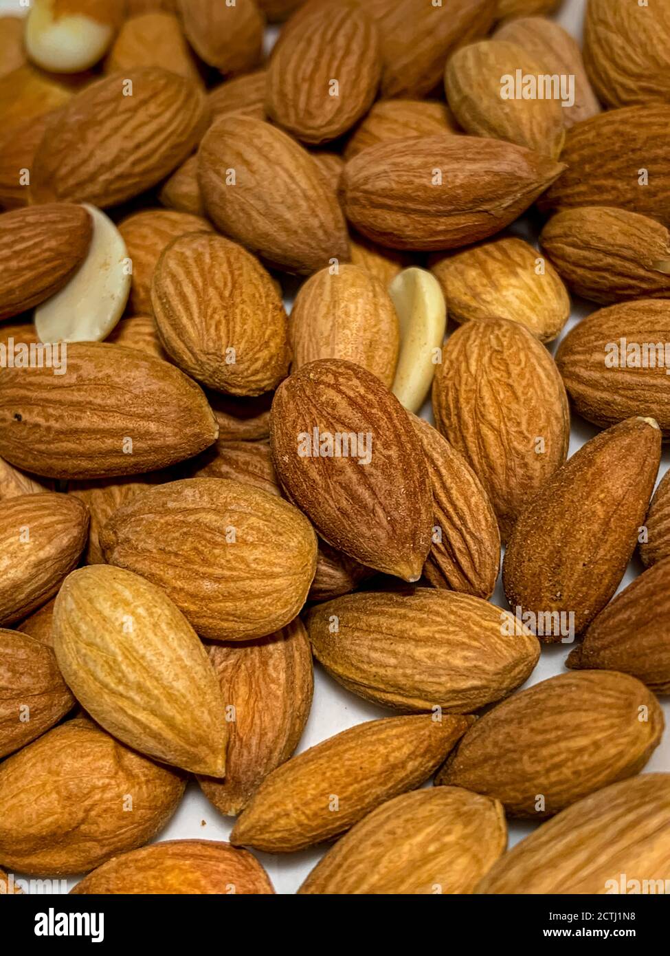 Vertical closeup top view shot of almonds Stock Photo - Alamy
