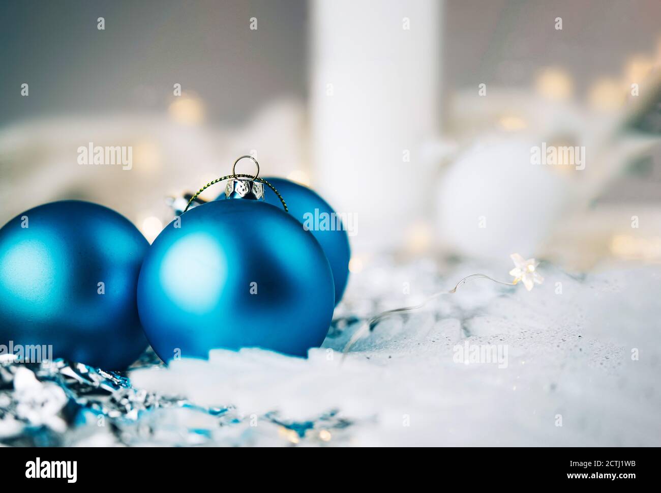 White and blue holiday decorations on silver background. Christmas ...