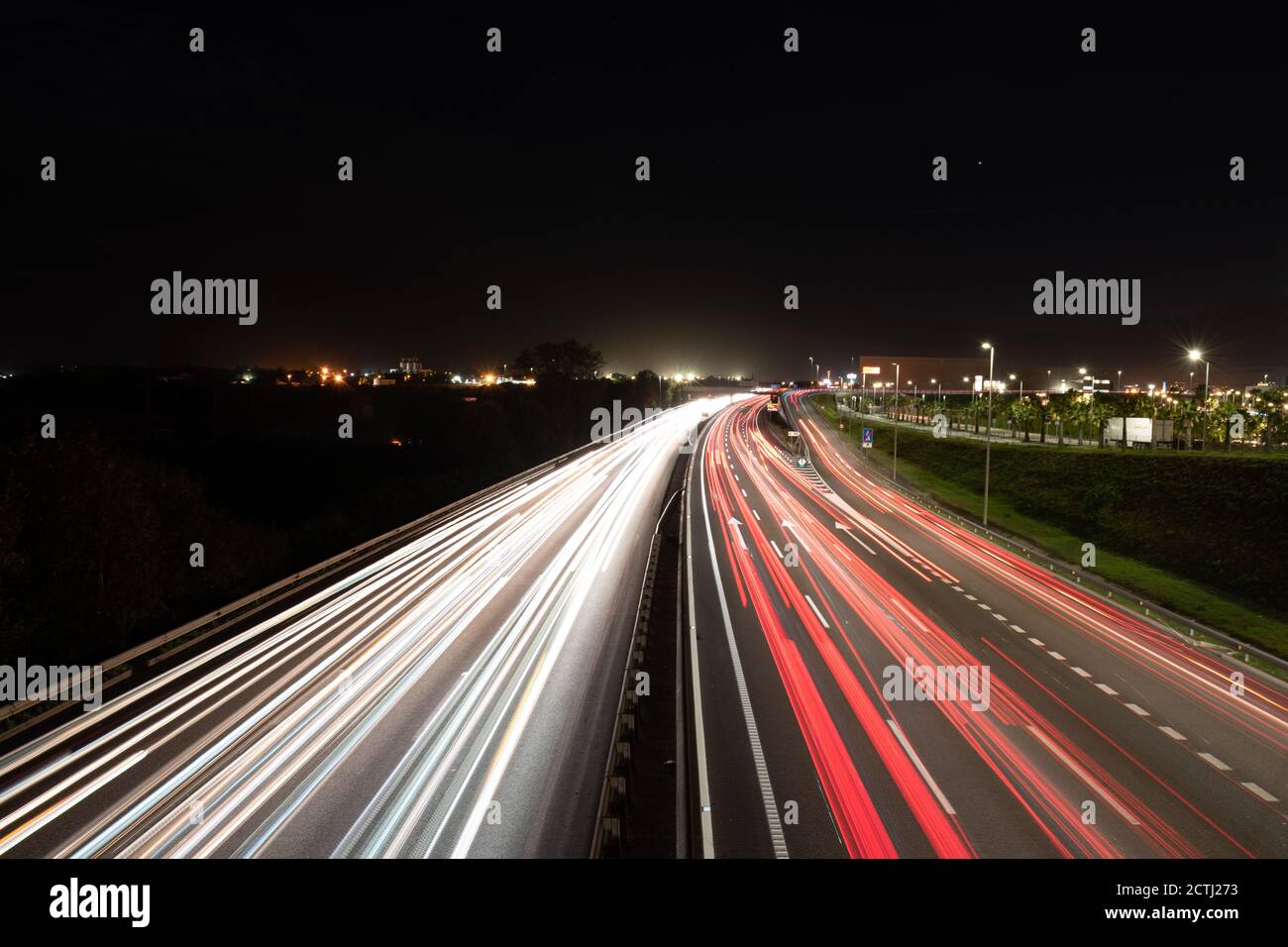 Timelapse shot of traffic lights on the road at night time Stock Photo ...