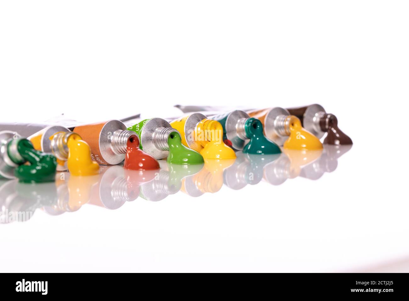 Set of colorful acrylic paint tubes, isolated white background. Copy ...