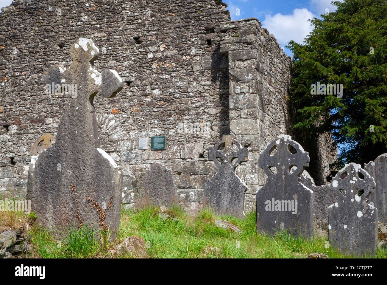 A Glendalough graveyard with a Glendalough Cathedral in the backgroung ...