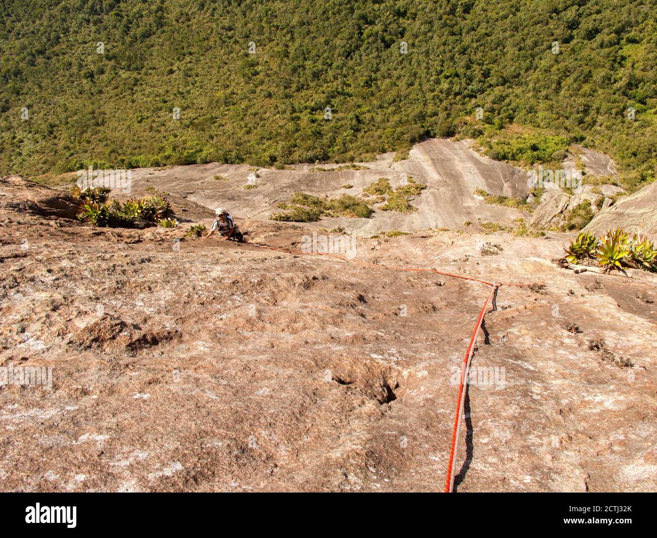 Rock climber climbing a sloping rock wall in Brazil Stock Photo - Alamy