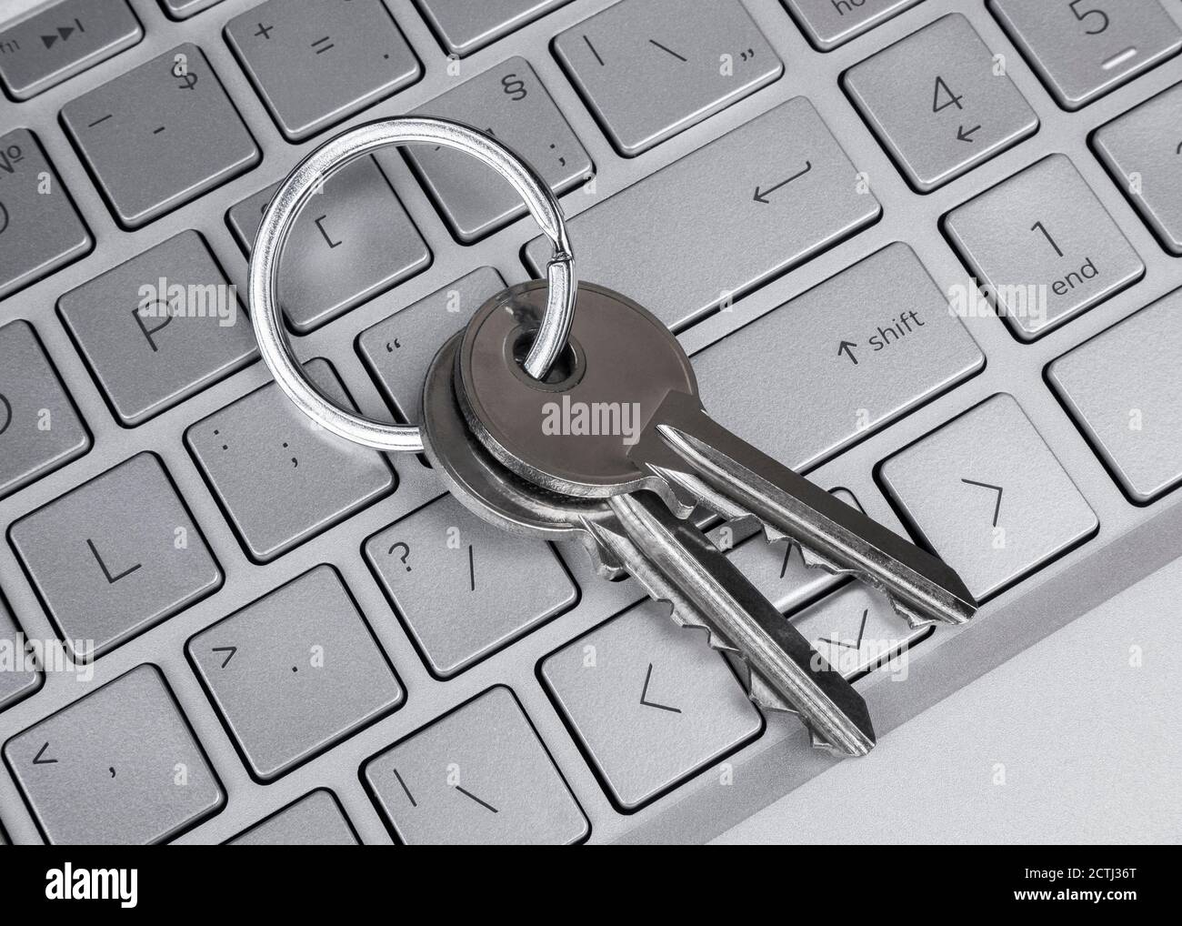 Bunch of keys on laptop keyboard Stock Photo - Alamy