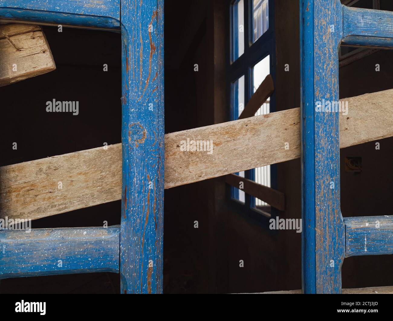 Blue wooden frames from the windows on a black wall background Stock ...