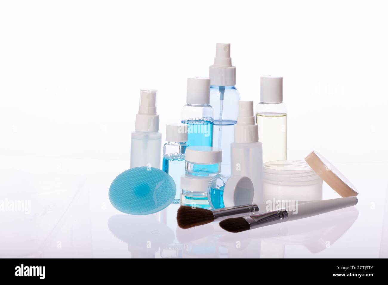 Set of skincare products, makeup tools, bottles with natural liquids ...