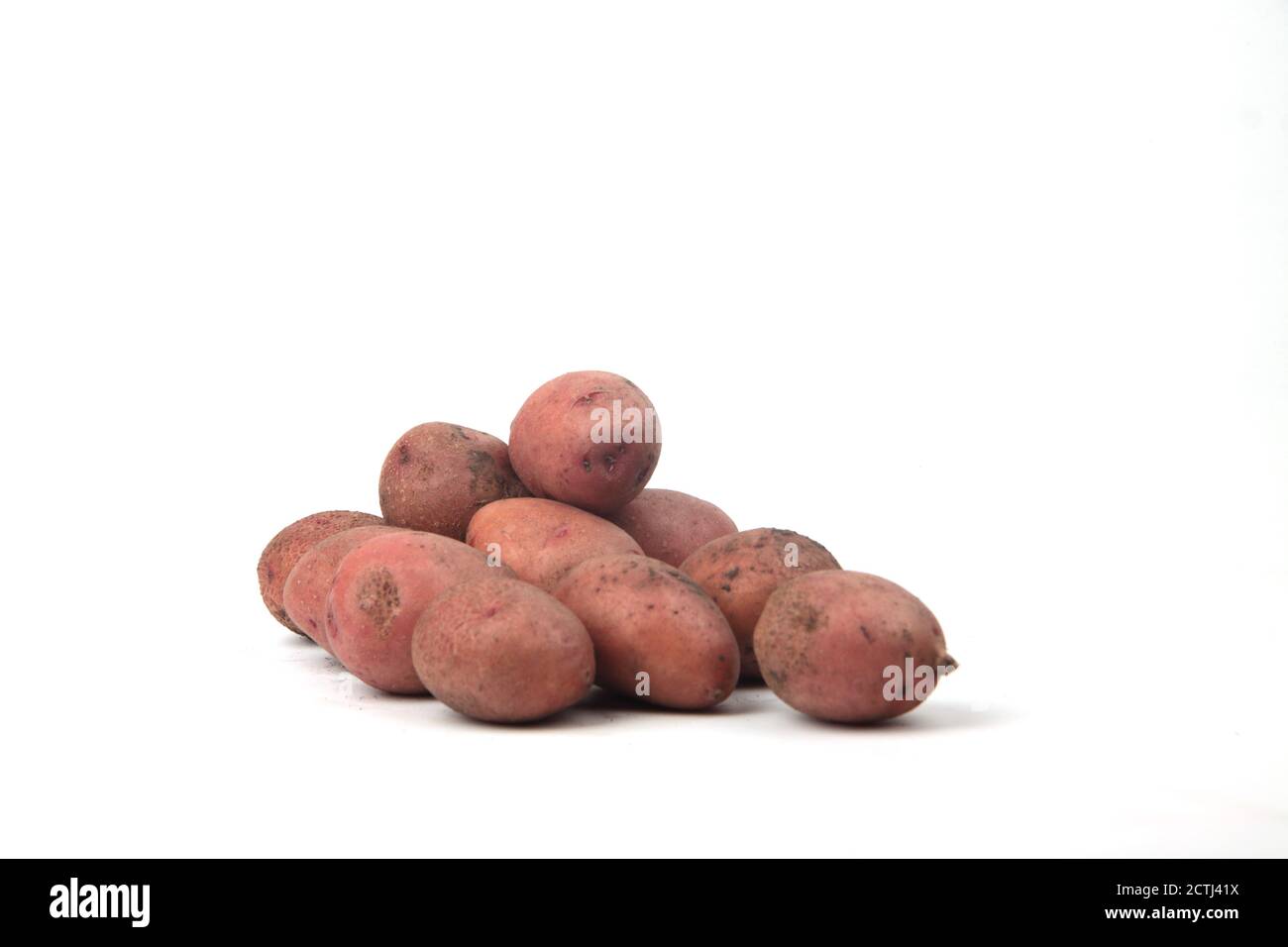 a pile of potatoes isolated on white background. Harvesting concept ...