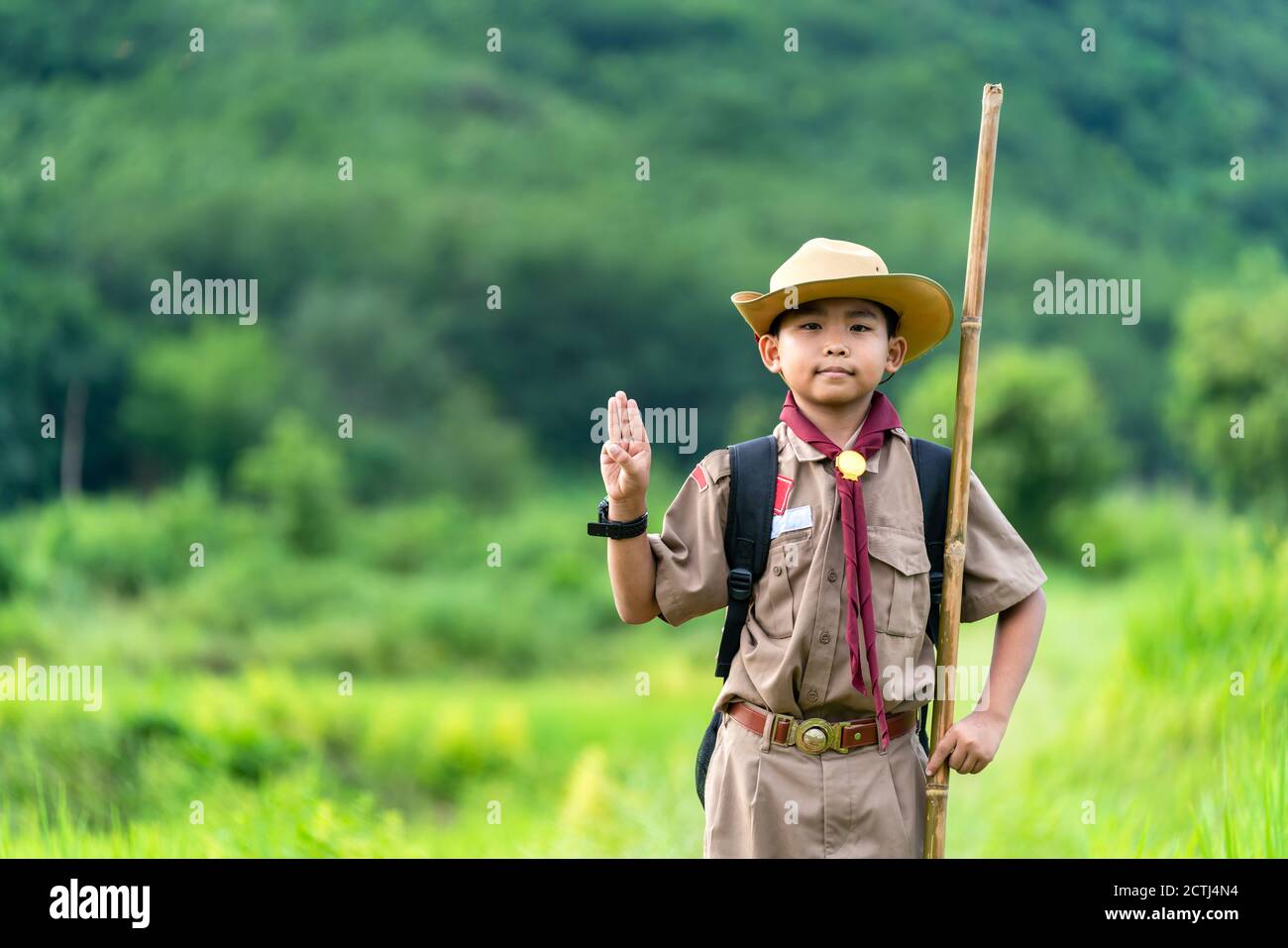 Asian boy Scout honor hand gesture Stock Photo - Alamy