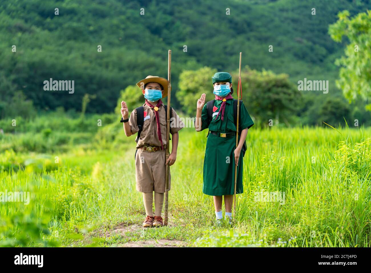 Asian Scout wearing a mask and Show scout symbol, new normal Stock ...
