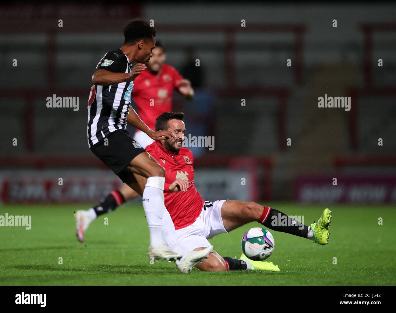 Morcambe's Josh Harrop (right) challenges Newcastle United's Jacob ...