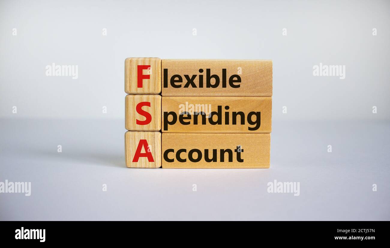 Concept words 'FSA, flexible spending account' on cubes and blocks on a beautiful white ...