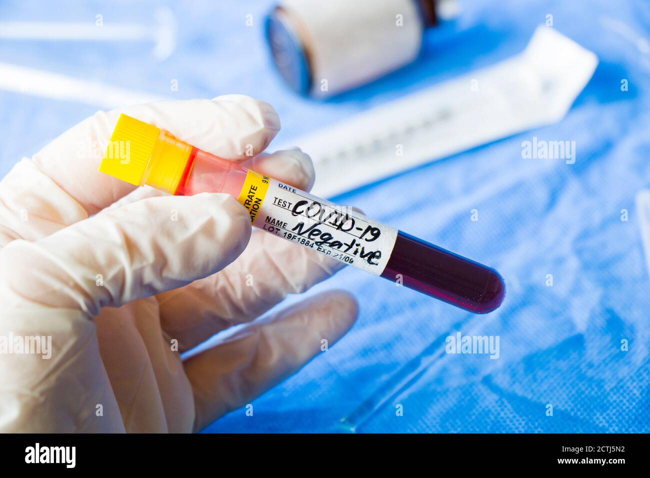 Corona virus negative blood test tubes on the white background, studio ...