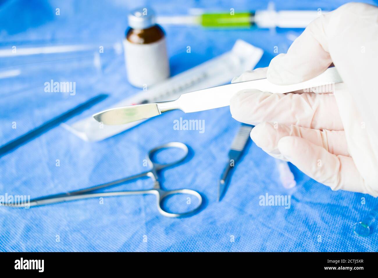 Surgery knife holding on the white background, studio shot. Operation ...