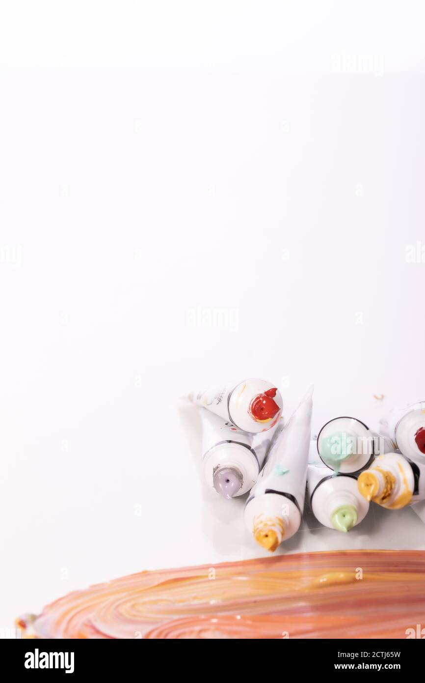 art exhibition invitation card mock-up. open tubes of colorful acrylic ...